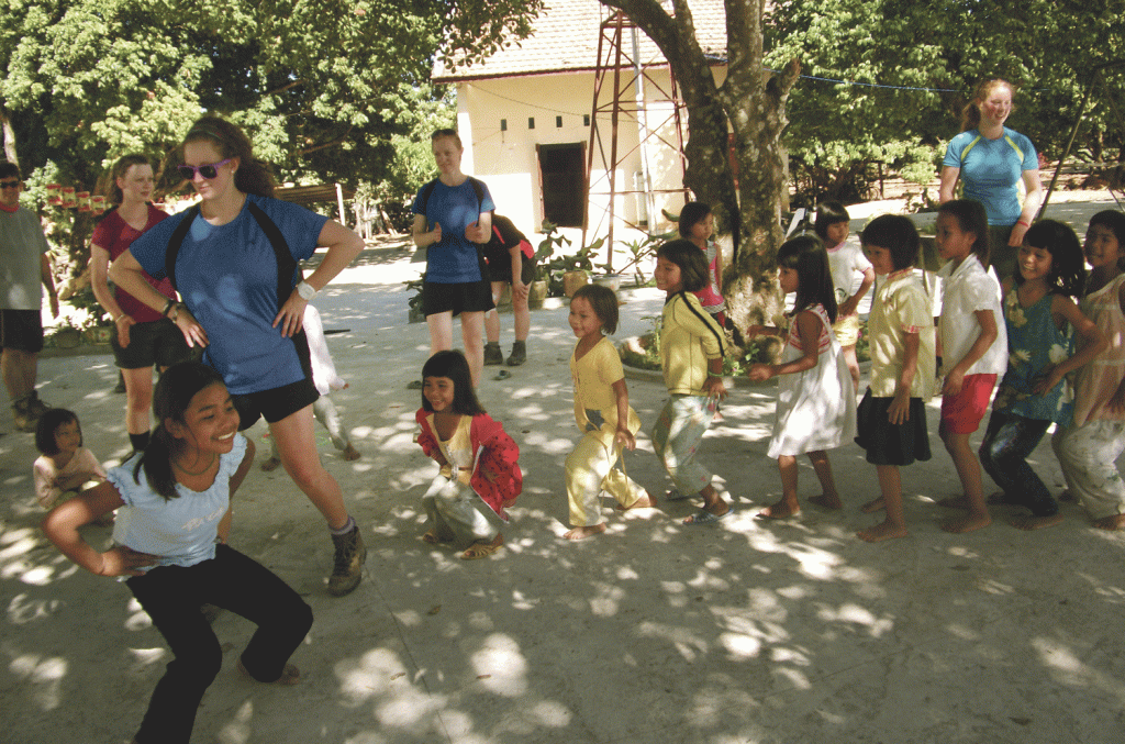 The team dancing and playing games with the children of an orphanage in ...